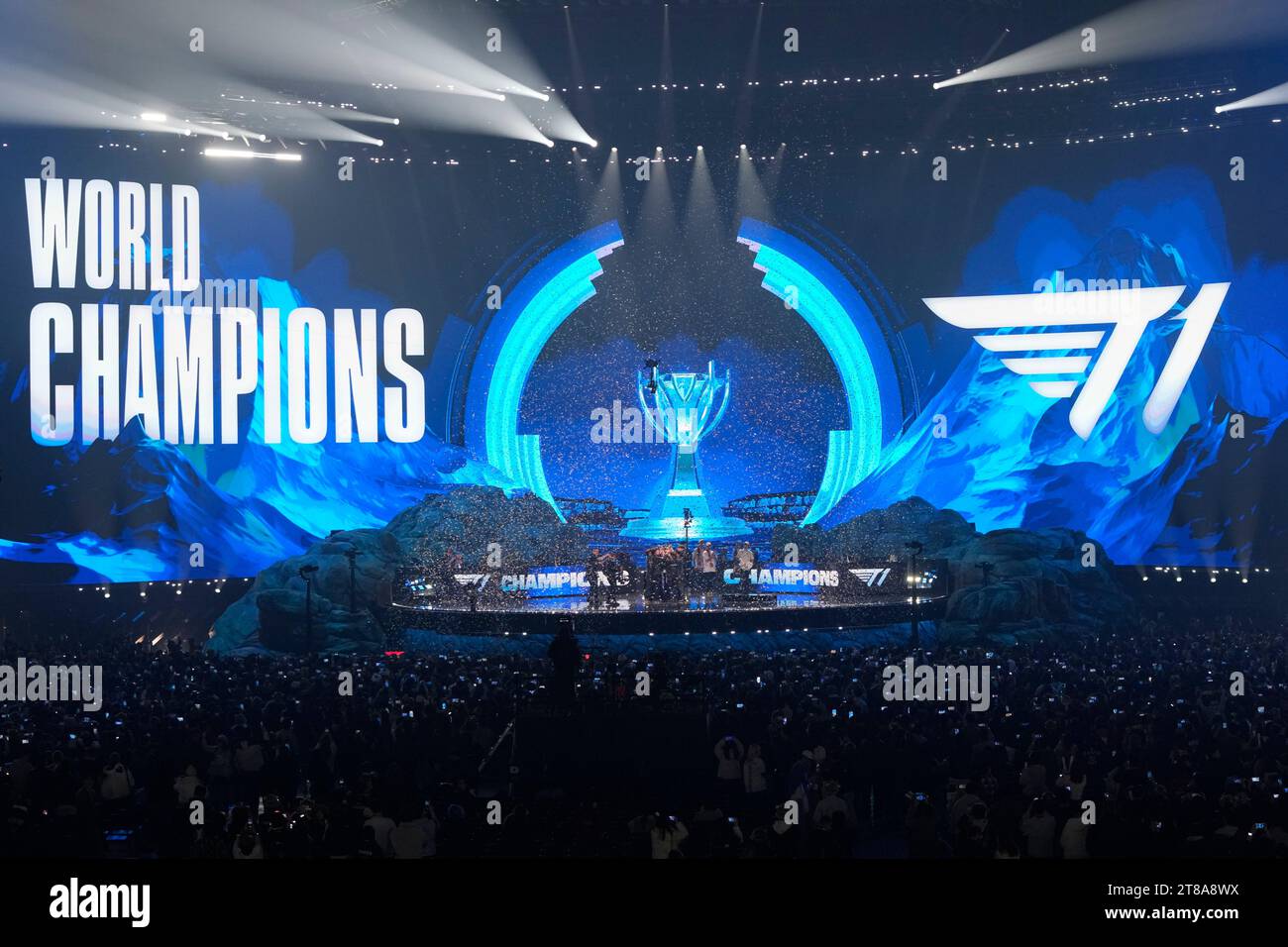Members of team T1 celebrate with winners' trophy after winning the ...