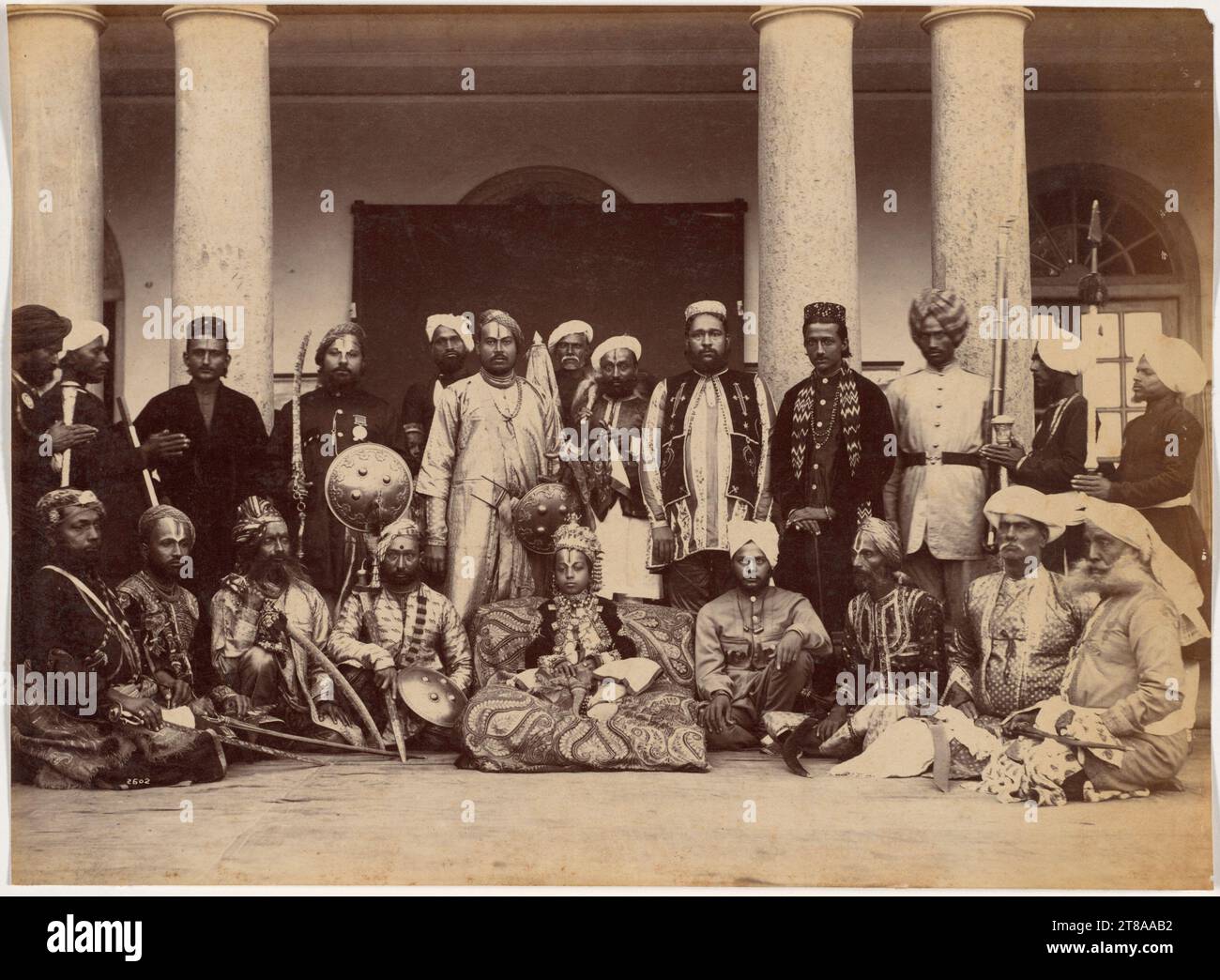 Deen Dayal uses the arrangement of people and the architecture to point ...