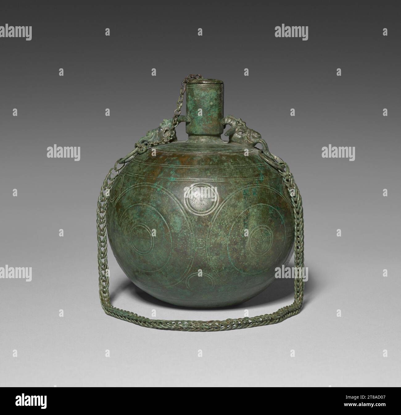 A utilitarian container, this nearly spherical cast bronze vessel ...