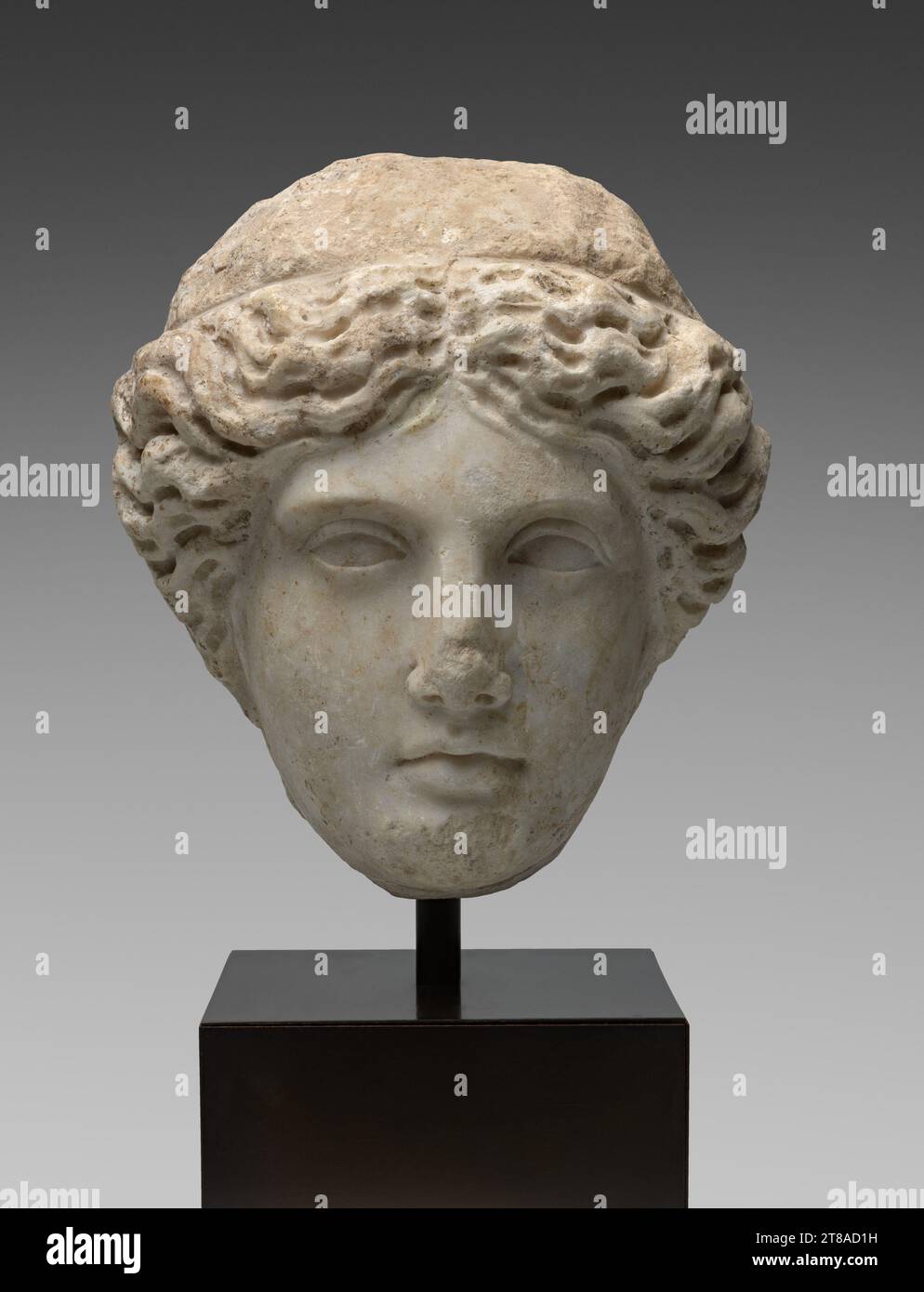 This marble head, about three-quarter life-sized with idealized ...