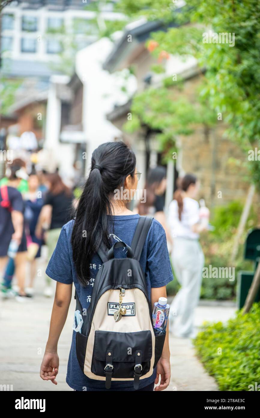Shanghai China 12th Jun 2023: a young girl is walking on the stree of ...