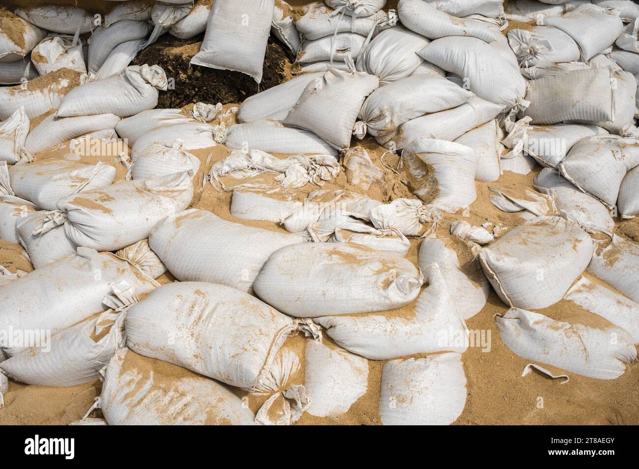 Pile of sandbags and sand ready to be used in a flood Stock Photo - Alamy