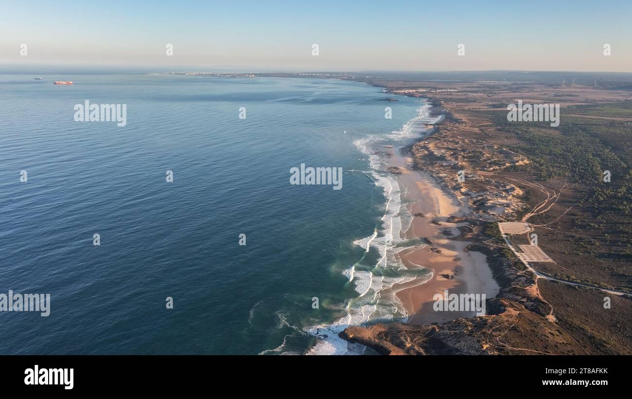 An aerial view of Malhao beach popular for surfing and vacationing ...