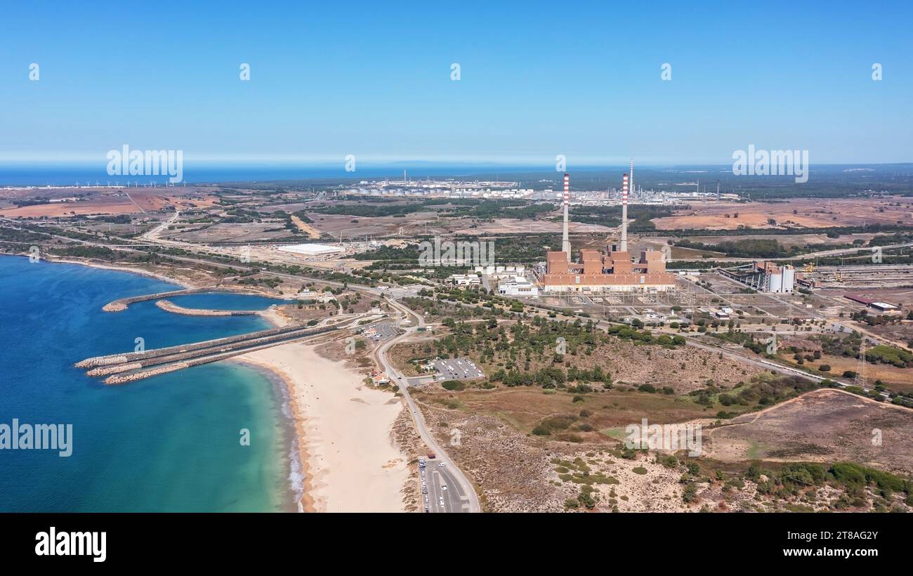 Aerial view of a coal-fired power plant in the city of Sines and sea ...