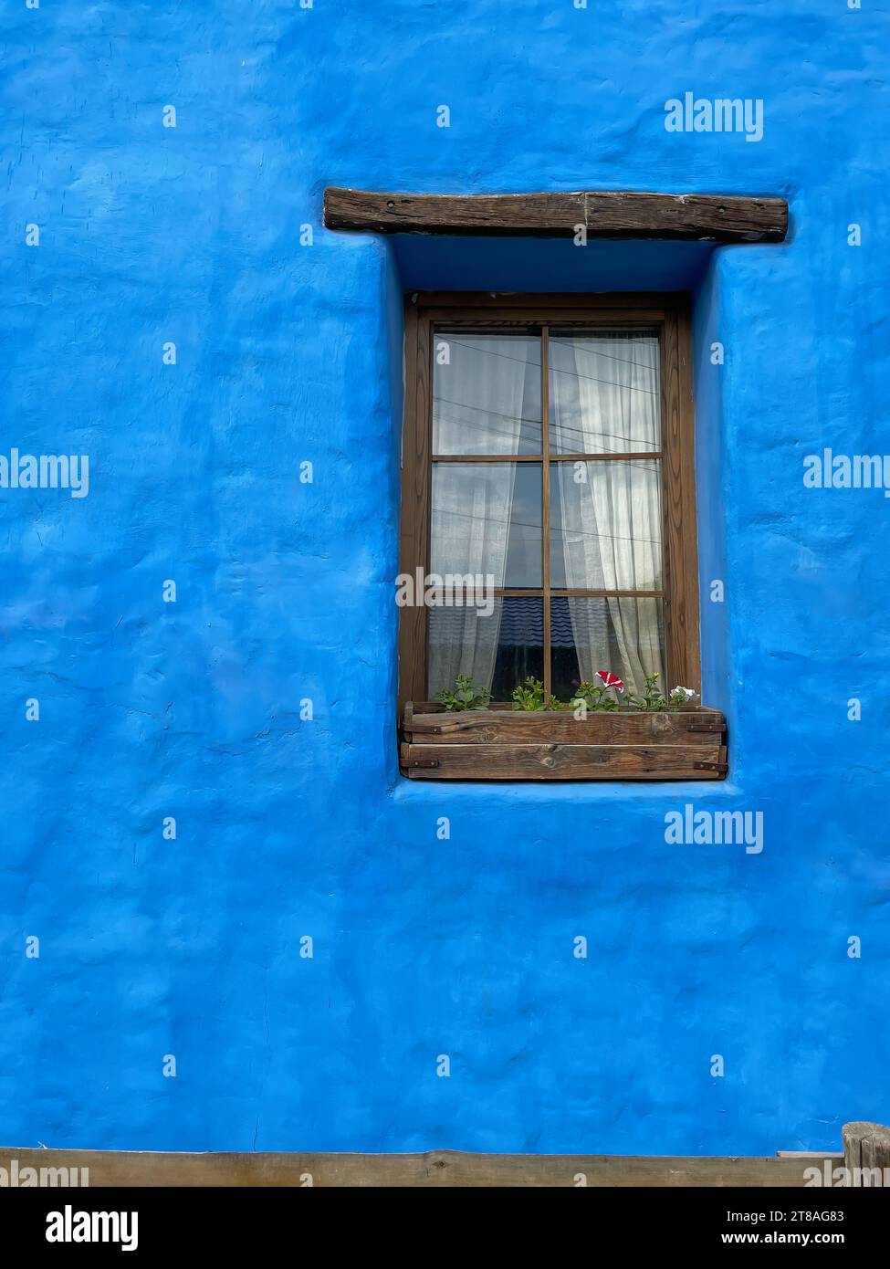 blue vintage wall with one window as background texture Stock Photo - Alamy