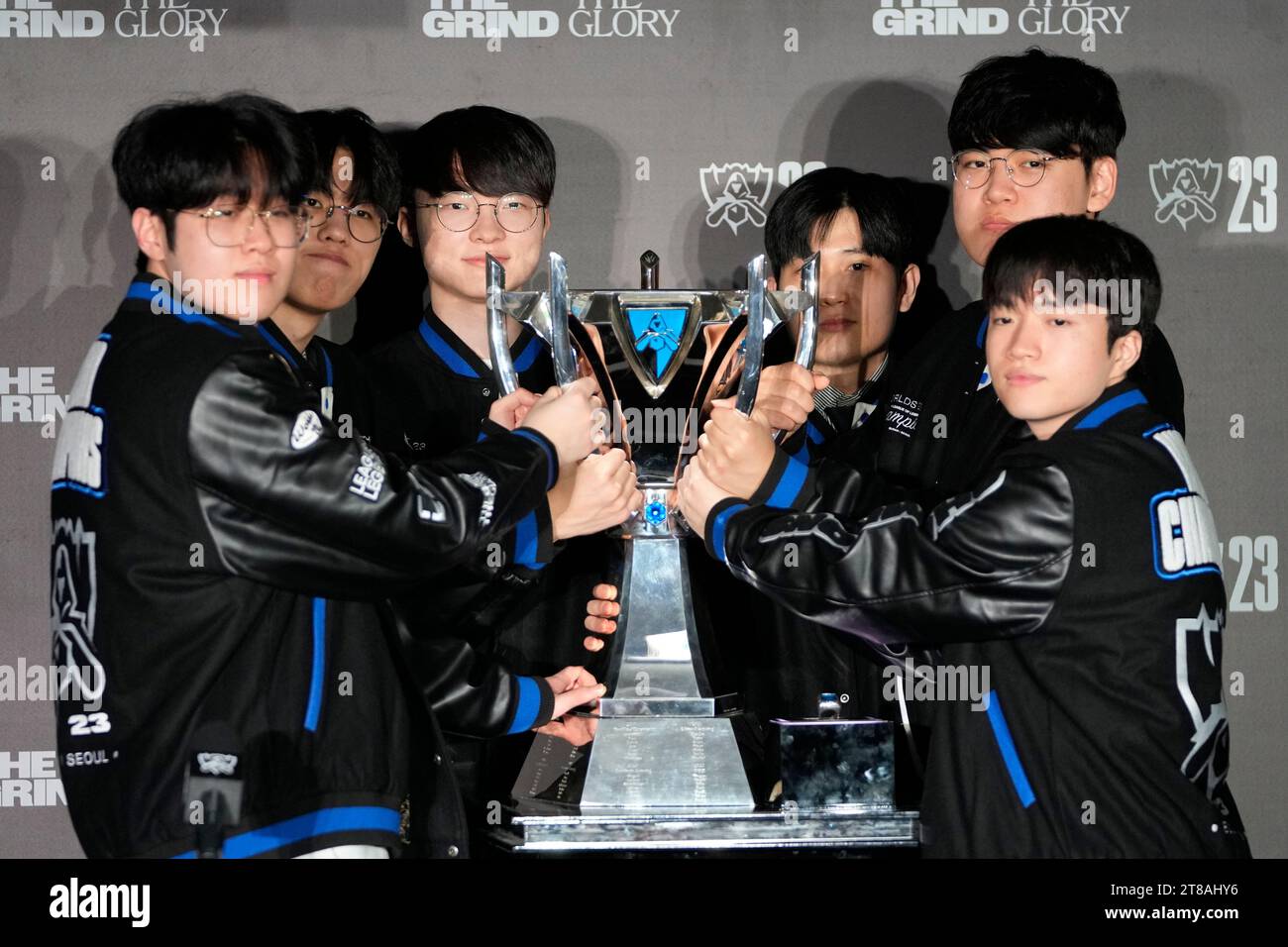 Members of team T1 celebrate with winners' trophy after winning the ...