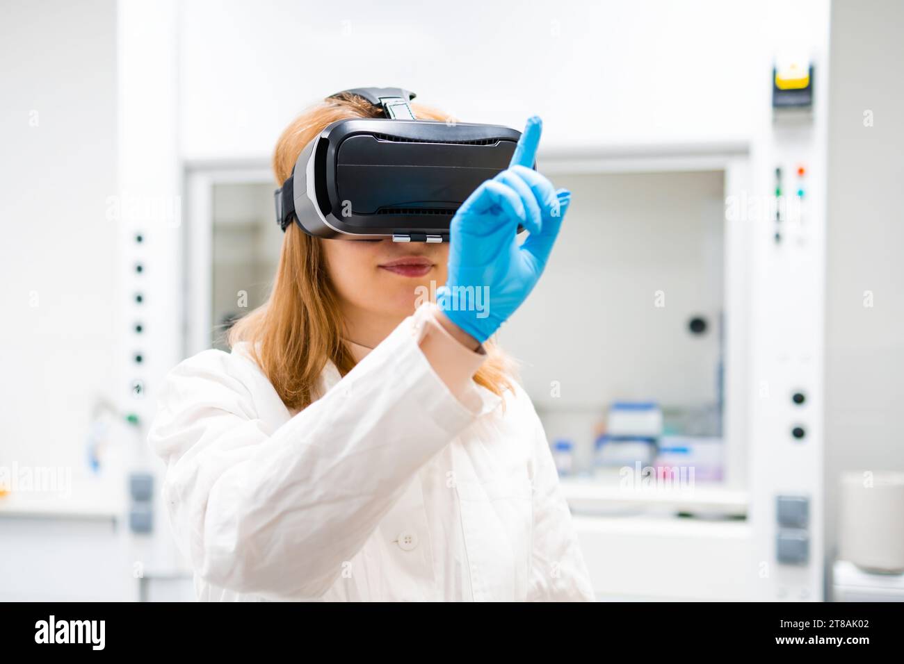 Woman scientist in VR goggles uses augmented reality for making ...