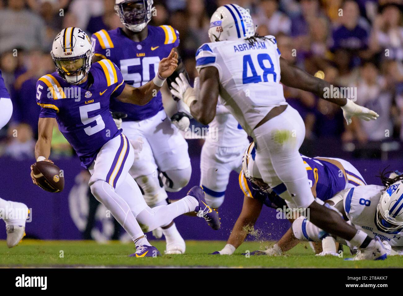 LSU quarterback Jayden Daniels (5) runs against Georgia State ...