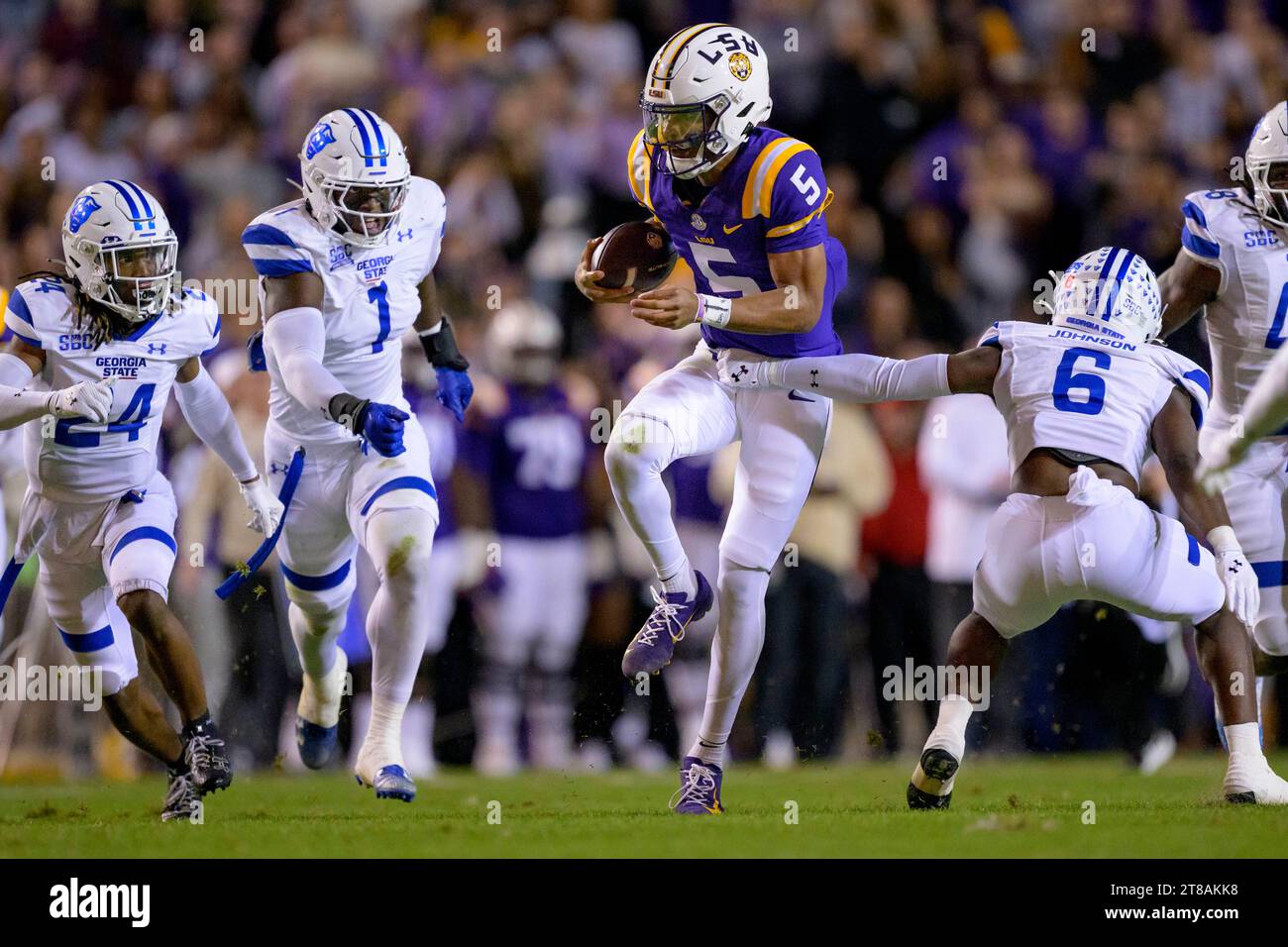 LSU quarterback Jayden Daniels (5) runs Georgia State safety Jeremiah ...