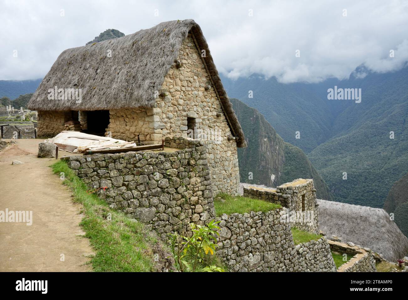 Machu Picchu, Peru, October 6, 2023. A Stone structure with thatched ...