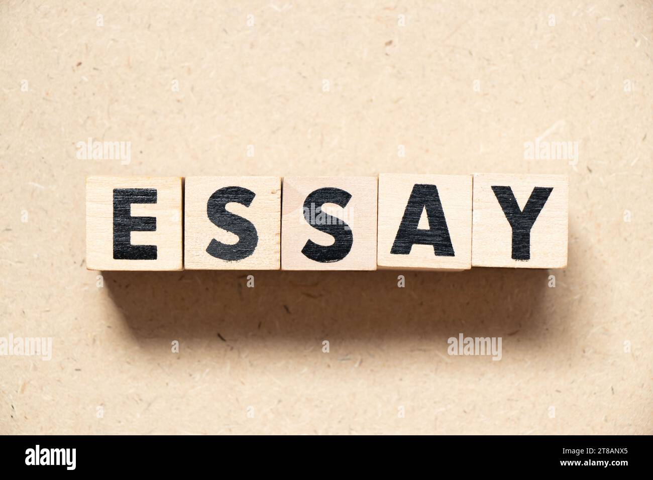 Alphabet letter block in word essay on wood background Stock Photo - Alamy