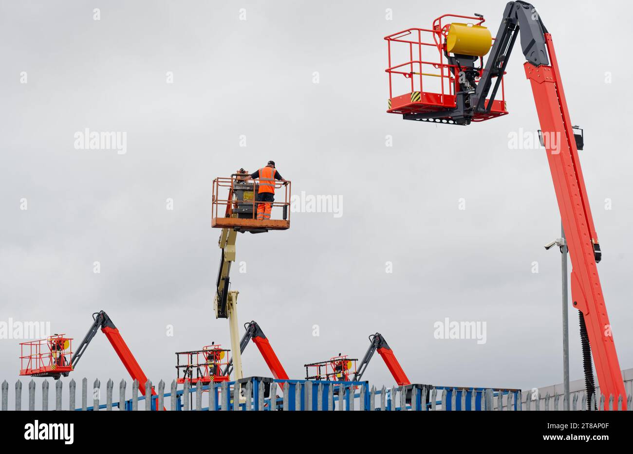 Access platform equipment powered high in sky at construction building ...