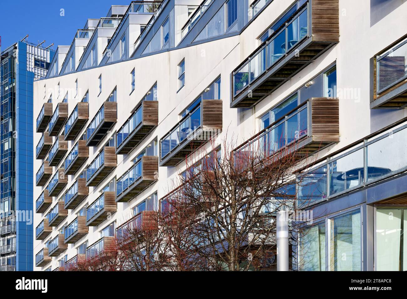 Modern high rise flats at new development on waterfront Stock Photo - Alamy