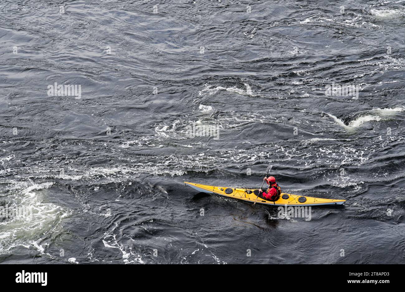 Canoe on fast flowing sea water at Oban in Scotland Stock Photo - Alamy
