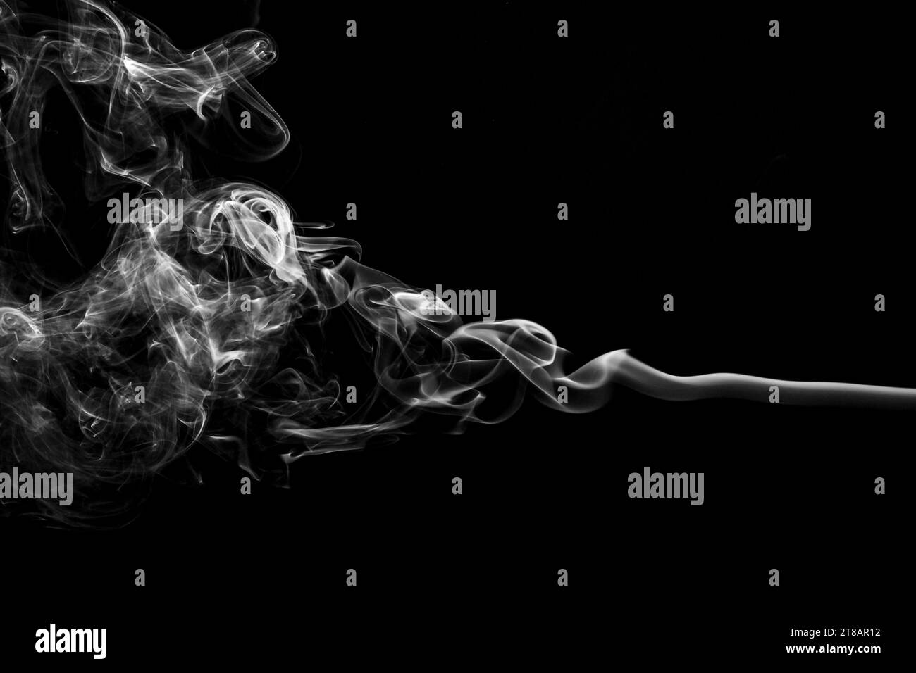 Incense sticks smoke on black background, black and white monochromatic ...