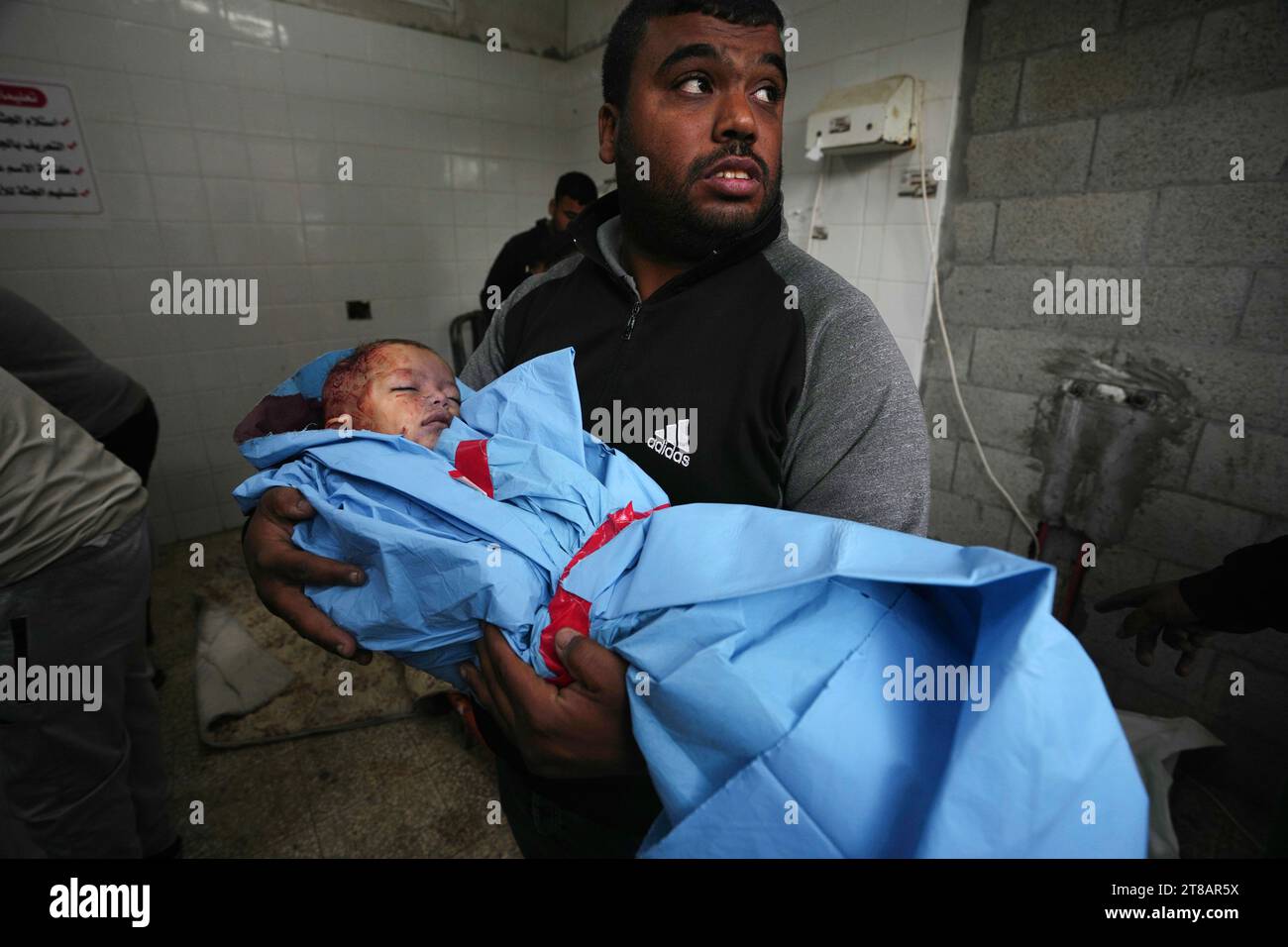 Palestinian relative carries the body of child Fawze Musleh, killed in ...