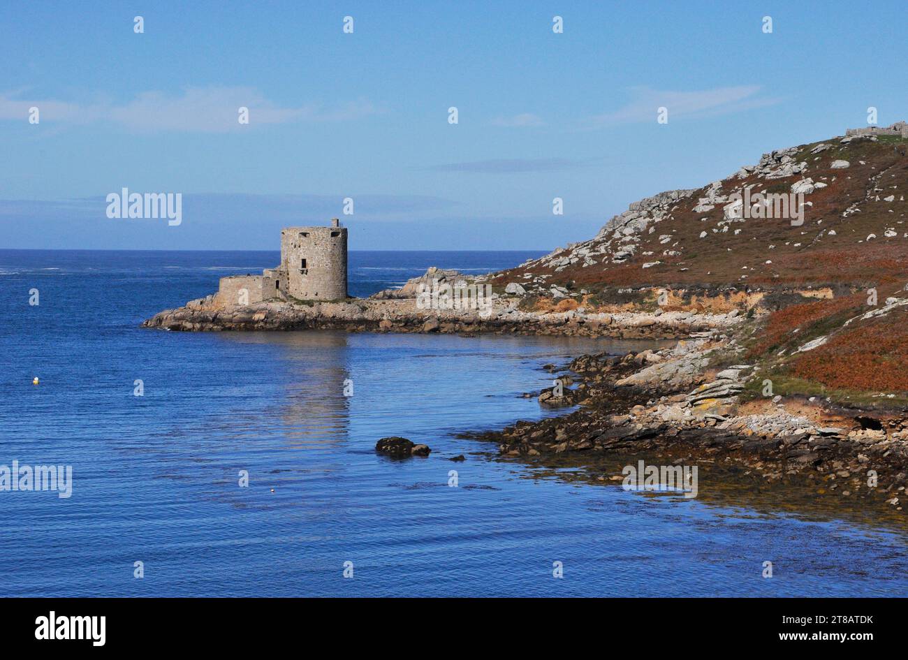 A reflection of Cromwells castle on Tresco in the unusually calm sea ...