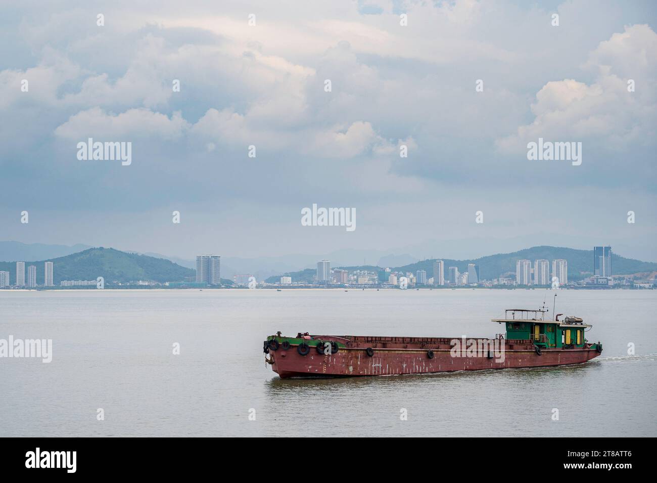 A commercial container ship, empty, saliing in the gulf of Tonkin, near ...