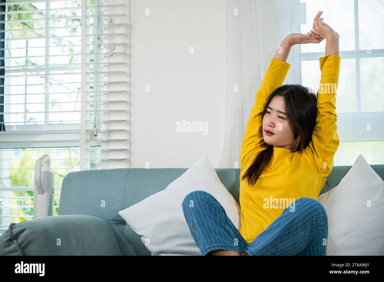 woman stretch oneself for relaxing activity feeling lazy on weekend on ...
