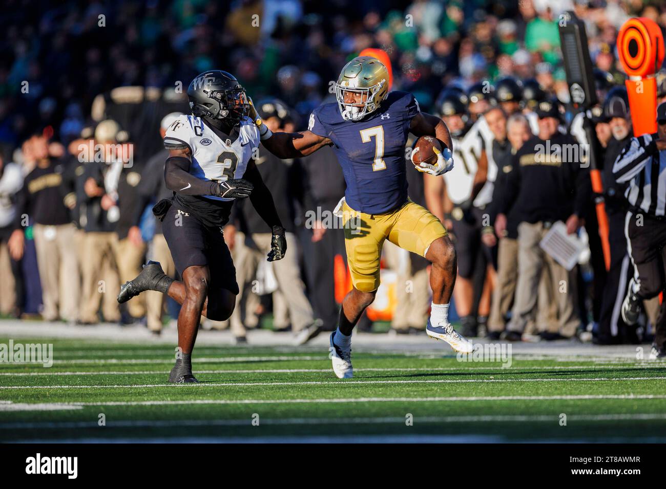 South Bend, Indiana, USA. 18th Nov, 2023. Notre Dame running back Audric Estimé (7) runs with ...