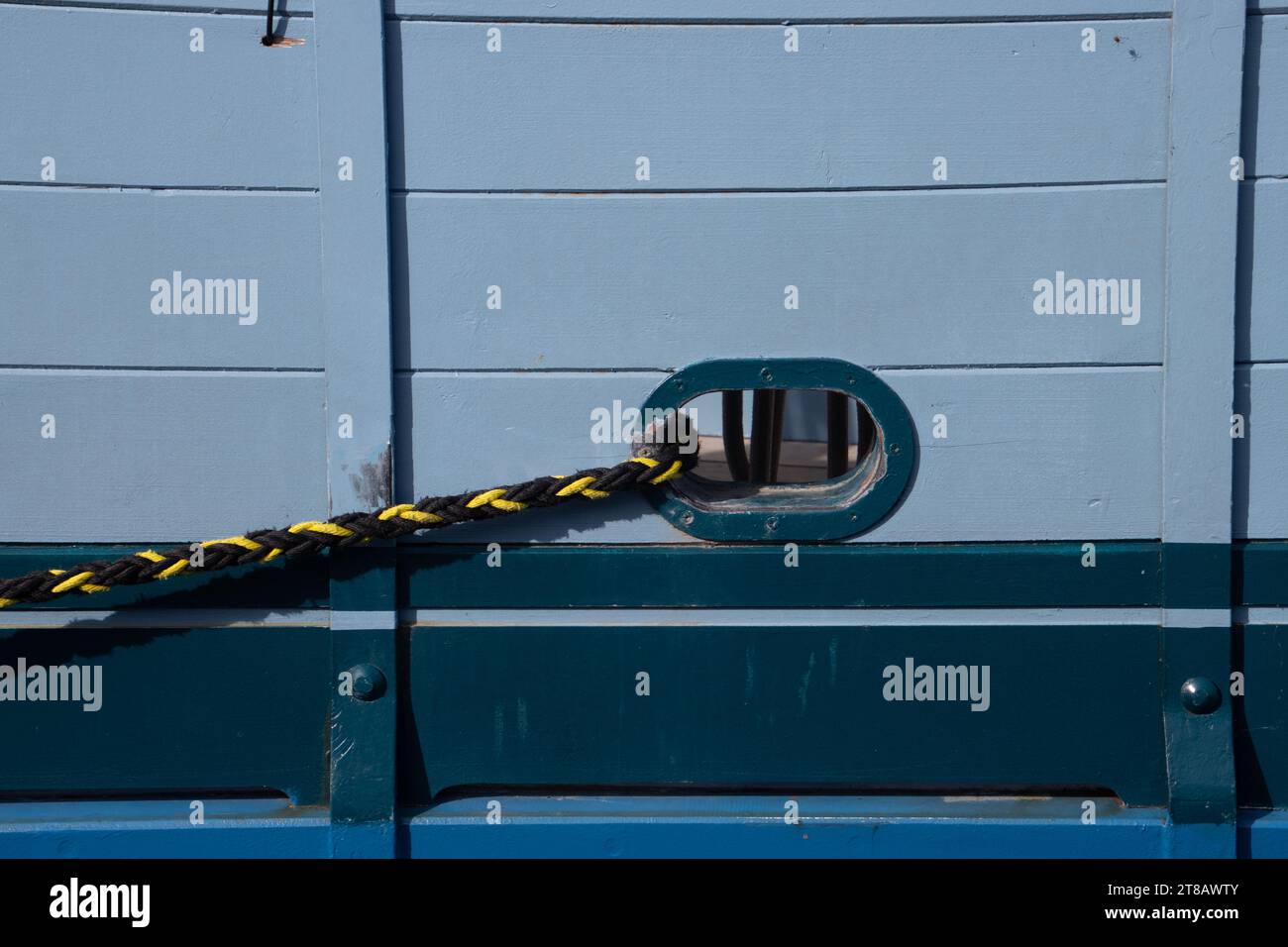 A detailed view of a blue Boats porthole and the contrasting Rope Stock ...