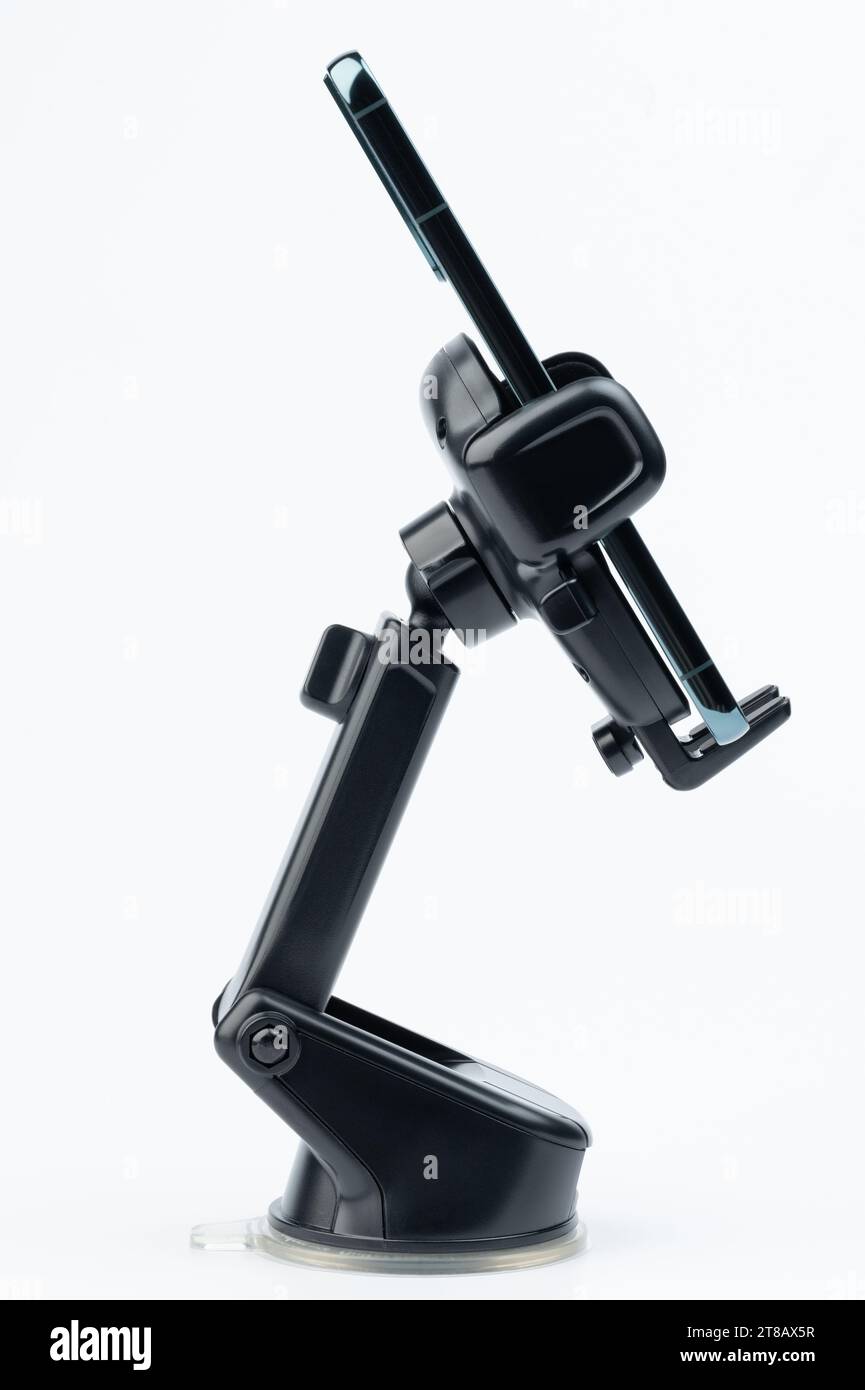 Black smartphone dash holder side view isolated on studio background ...