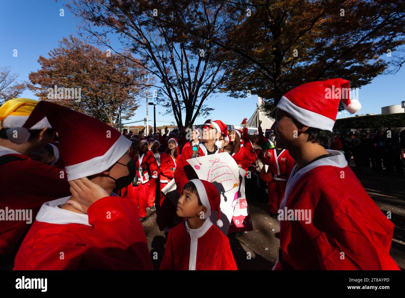 Tokyo, Japan. 19th Nov, 2023. People wearing Santa Claus costumes take ...