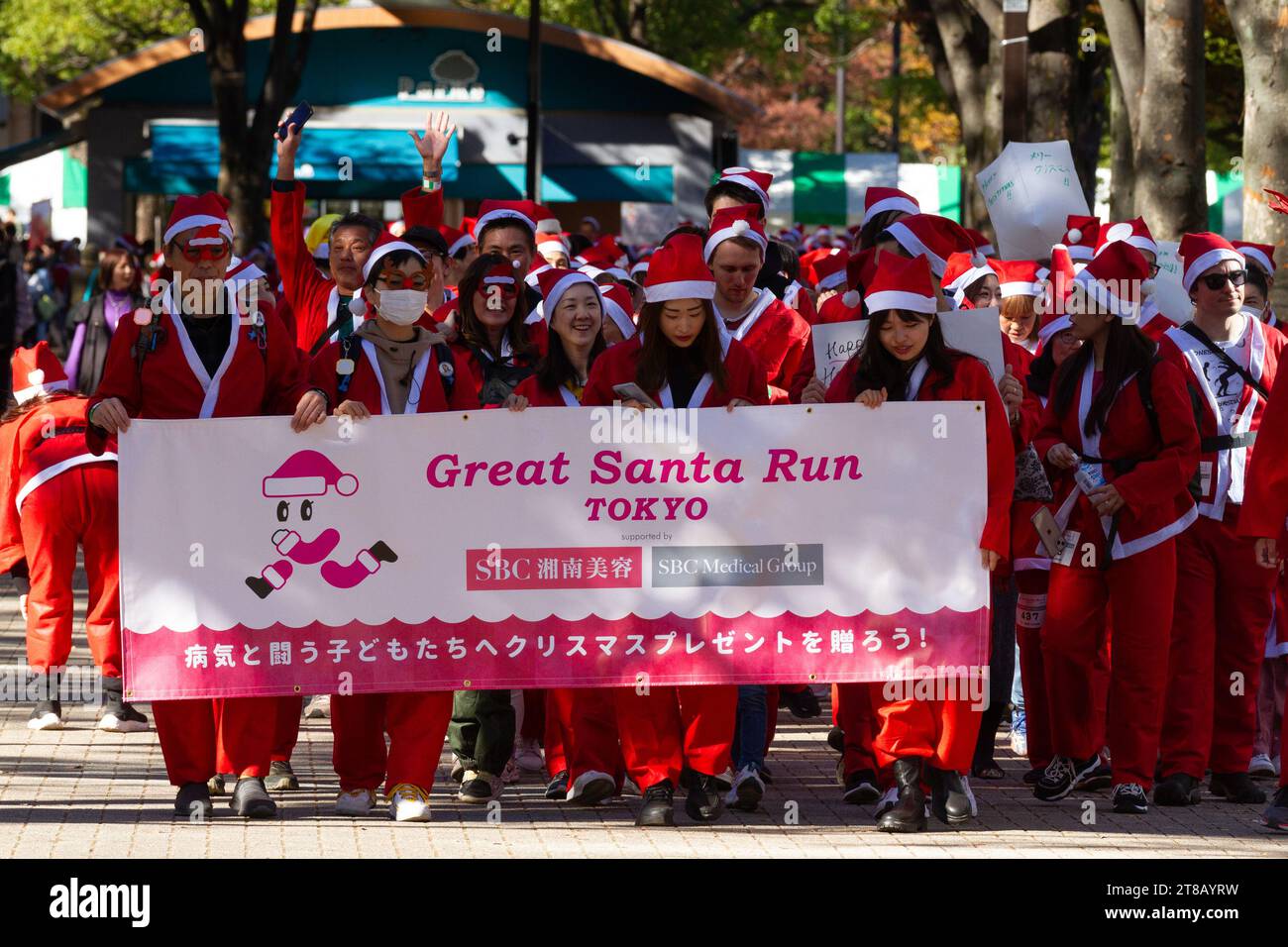 Tokyo, Japan. 19th Nov, 2023. People wearing Santa Claus costumes take ...