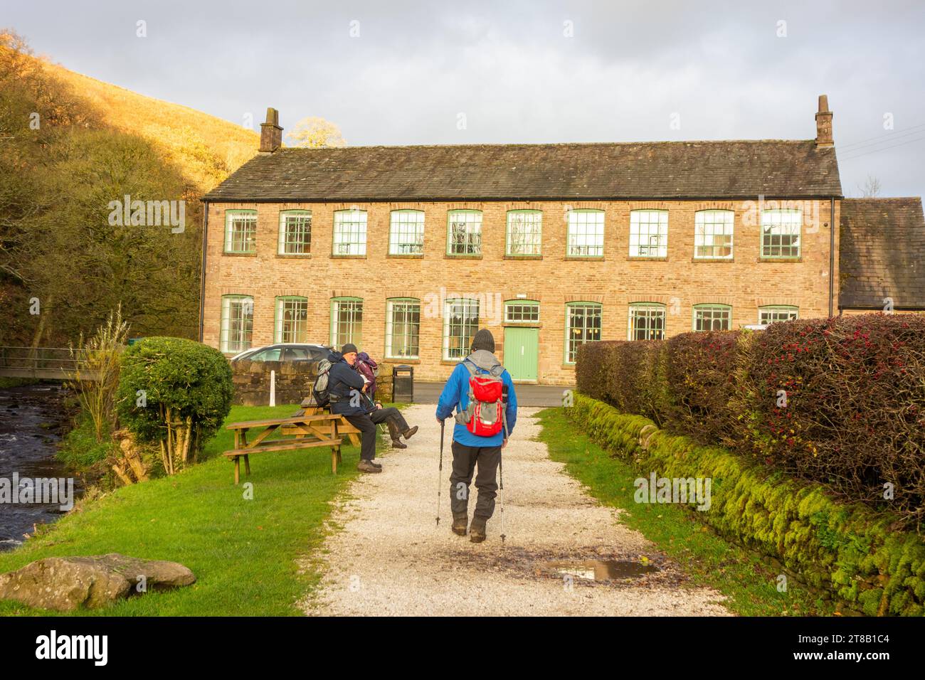 Walkers walking towards the former silk and flax mill of Gradbach ...