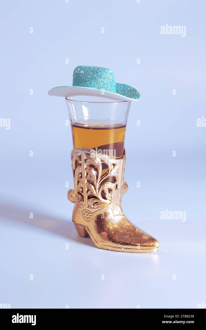 Lavish Gold Cowboy Boot Shot Glass with Tequila or Whiskey Stock Photo ...