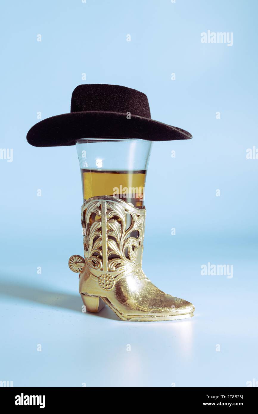 A Shot of the Wild West: Cowboy Boot Glass Stock Photo - Alamy