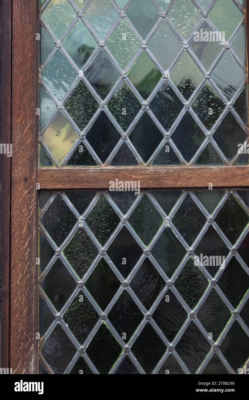 vintage window with mesh inside glass window.Antique, window close up ...