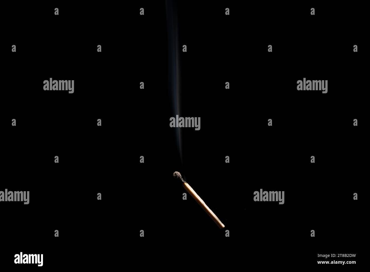 Lit and falling match on a black background Stock Photo - Alamy