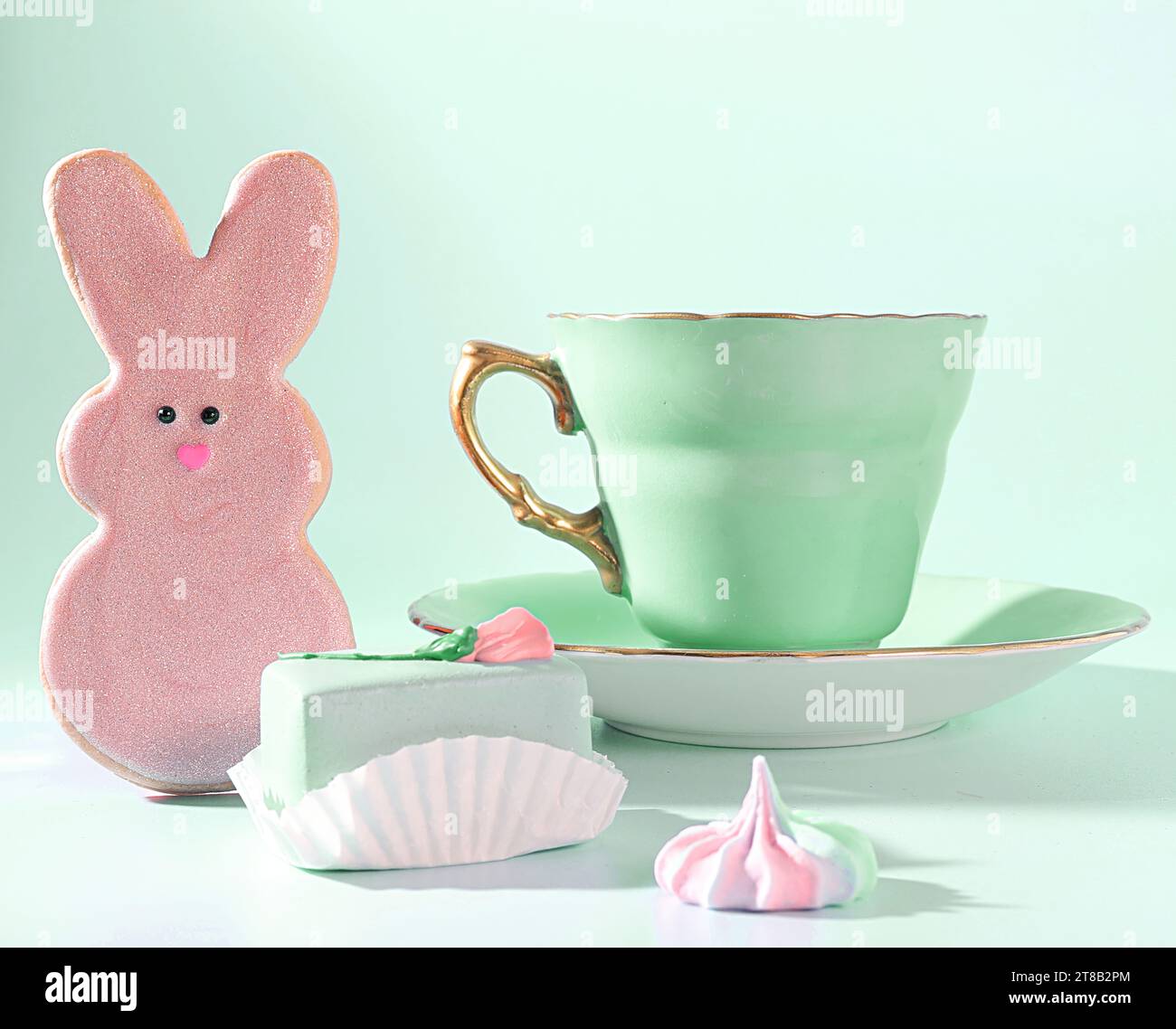 A Whimsical Easter Treat: A Pastel Green Teacup with a Gold Handle, a ...