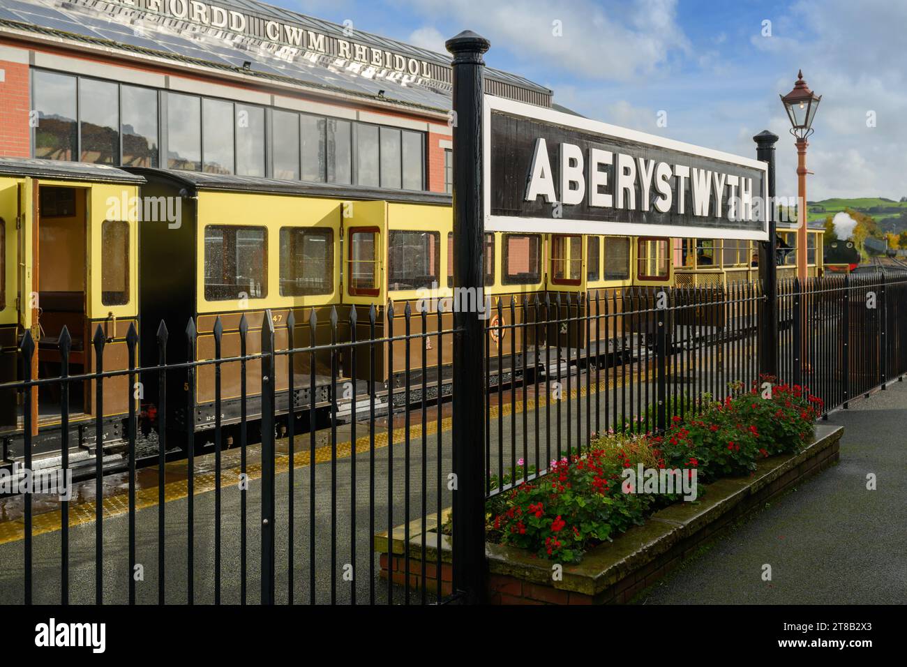 Third Class rolling stock and the Aberystwyth Station sign at the Vale ...