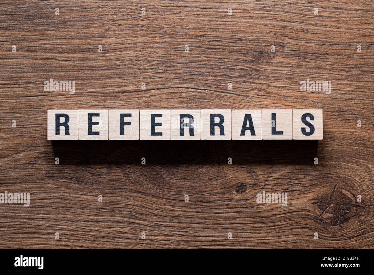 Referrals - word concept on building blocks, text Stock Photo - Alamy