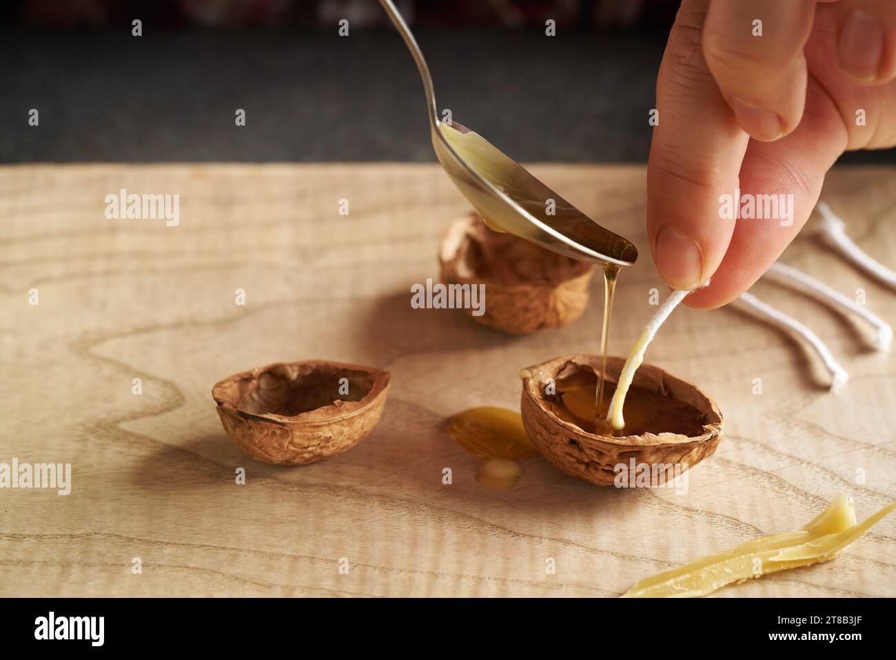 Pouring melted wax into a walnut shell - fabrication of Christmas ...