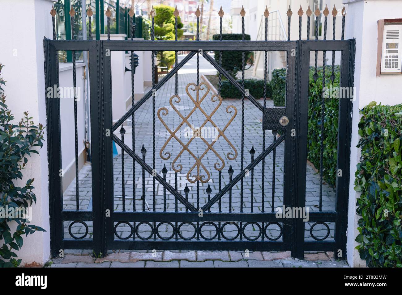 Metal wrought gates in a multi-storey complex.Worn iron. Metal fence ...