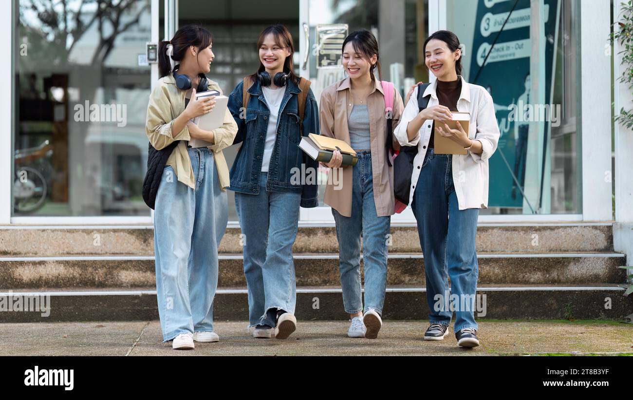 Group of Young Asian student walking and talking at university before ...