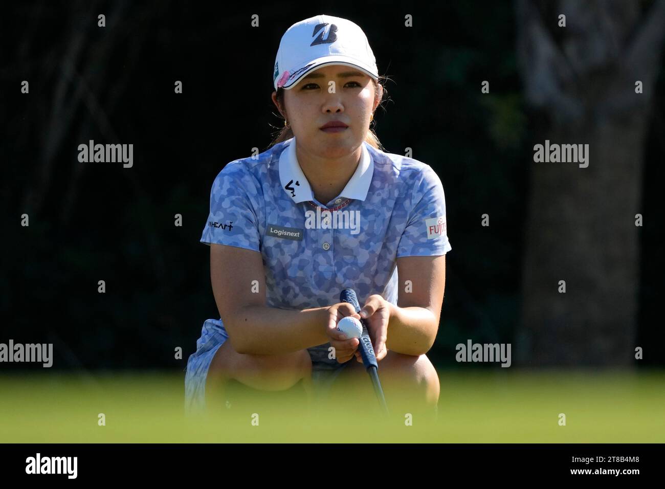 Ayaka Furue, of Japan, lines up her shot on the second green during the final round of the LPGA ...