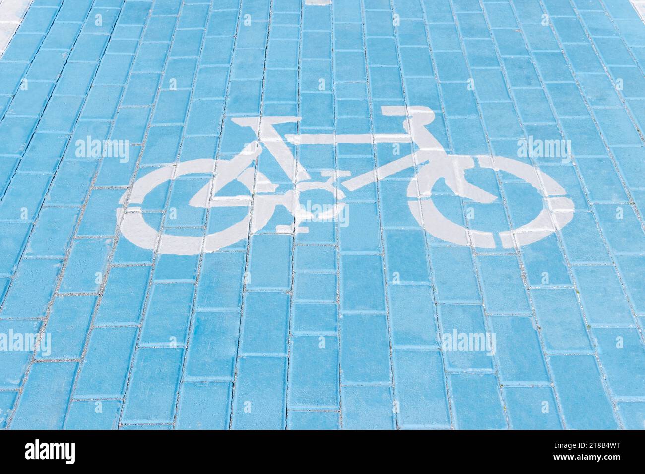 Bicycle path in blue close-up.Bicycle painted with white paint Stock ...