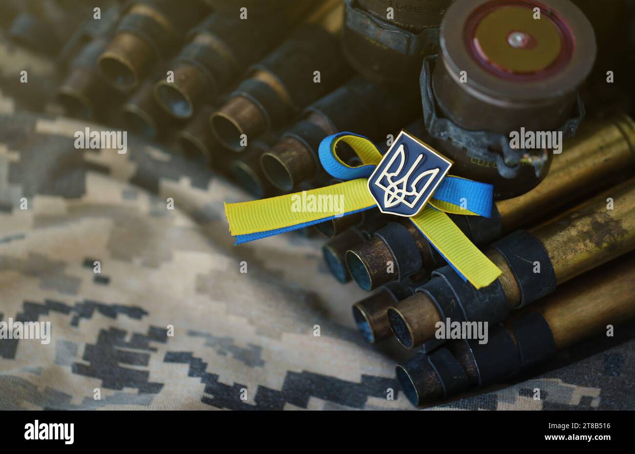 Ukrainian symbol on machine gun belt lies on ukrainian pixeled military ...
