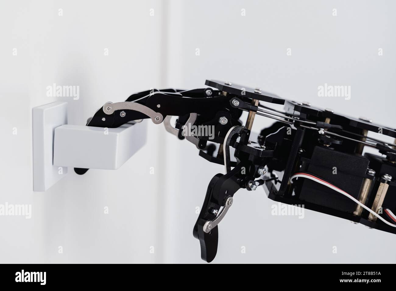 Real robot's hand holding door handle. Concept of robotic process ...