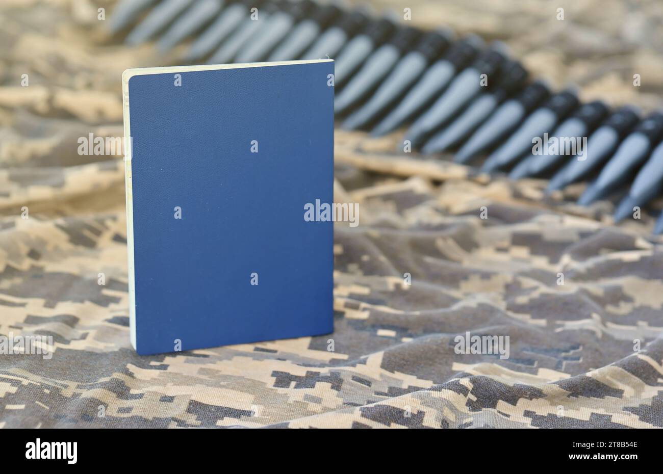 Ukrainian foreign passport on fabric with texture of military pixeled ...