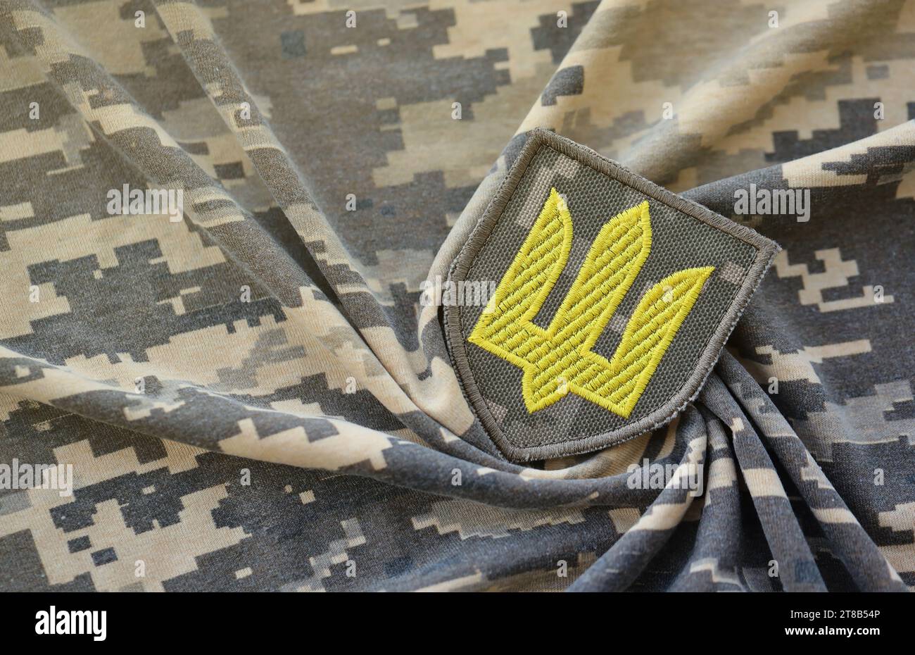 Symbol of Ukrainian army on the camouflage uniform of a Ukrainian ...