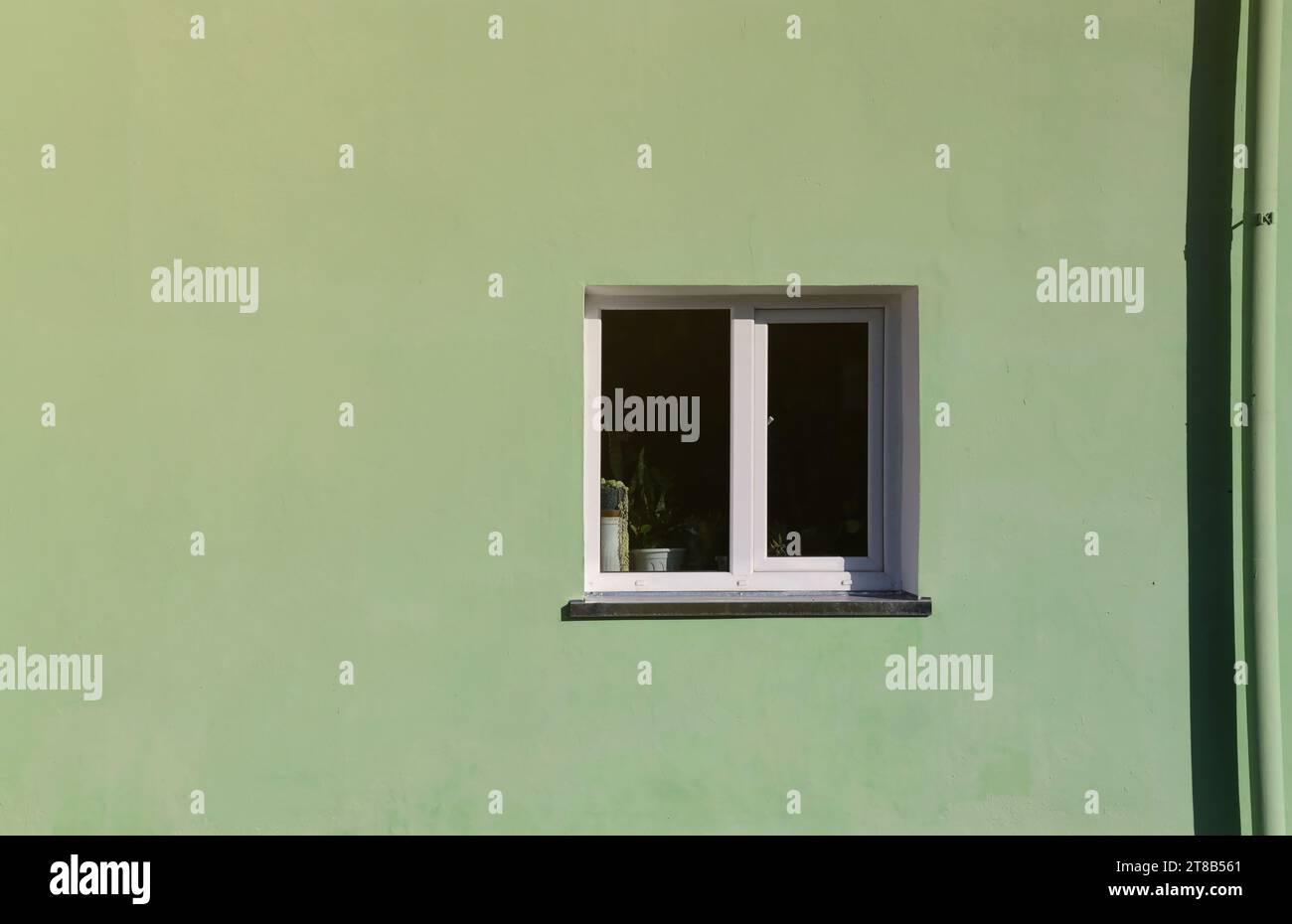 Vintage white window on mint green wall in sunlight close up Stock ...