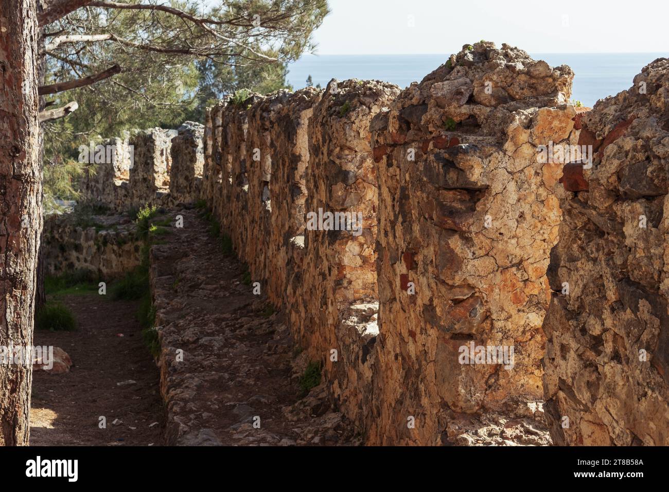 side view of the fence of the ancient fortress separates the sea there ...