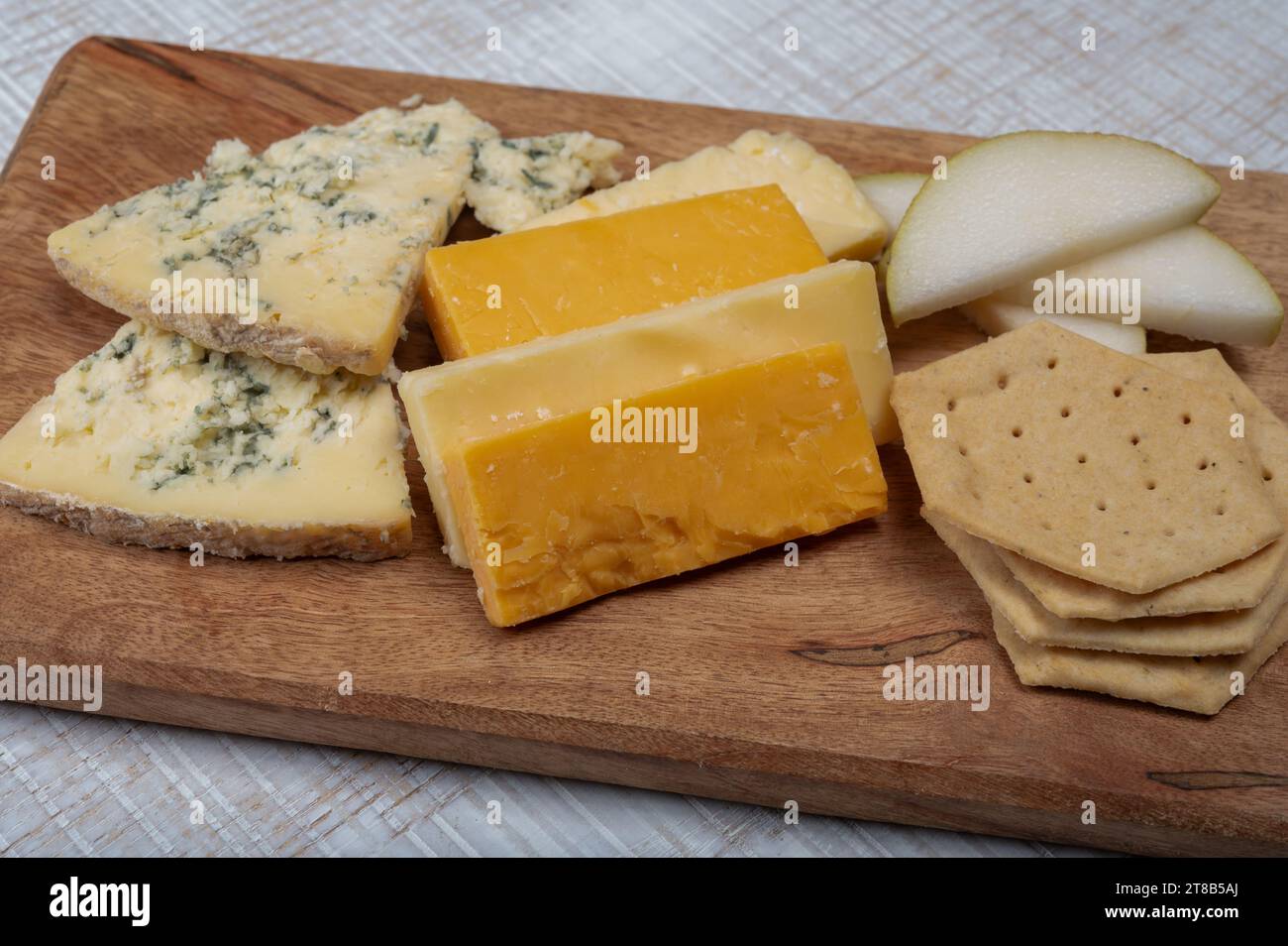 English cheeses collection, mature and coloured cheddar cheese and semi ...