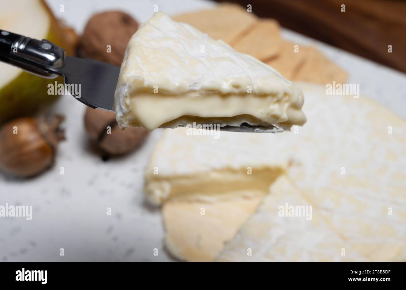 French soft Cremeux de Normandie cheese, soft creamy cheese with white ...