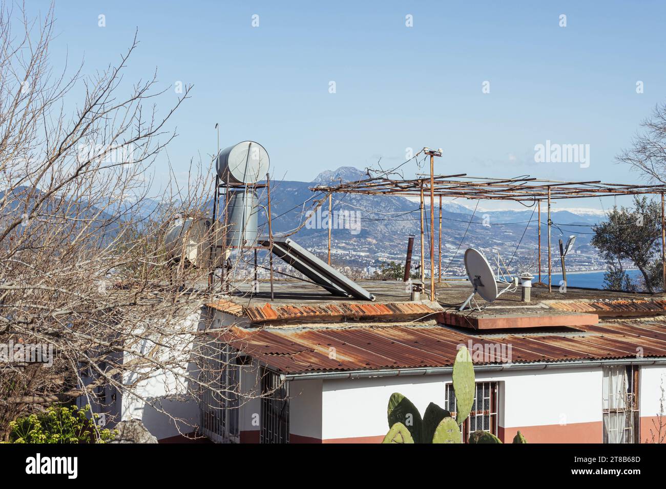 roof of the building with water heating system for the shower. High quality photo Stock Photo ...